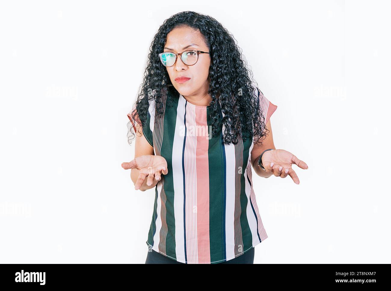 Puzzled afro woman gesturing with hand isolated. Girl in glasses with ...