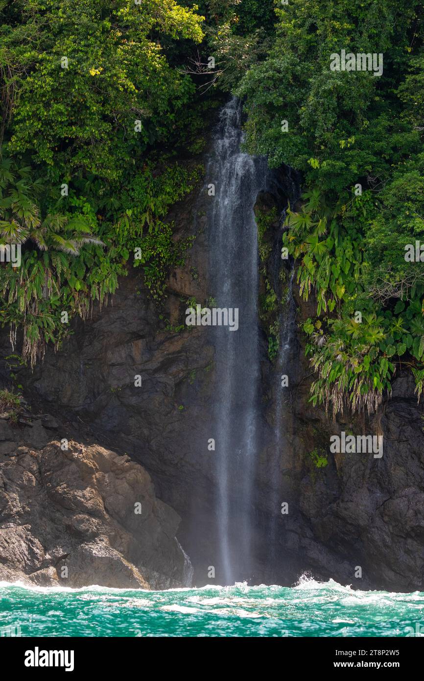 Waterfall falls into the Pacific Ocean, Ensenada de Utria, El Valle ...