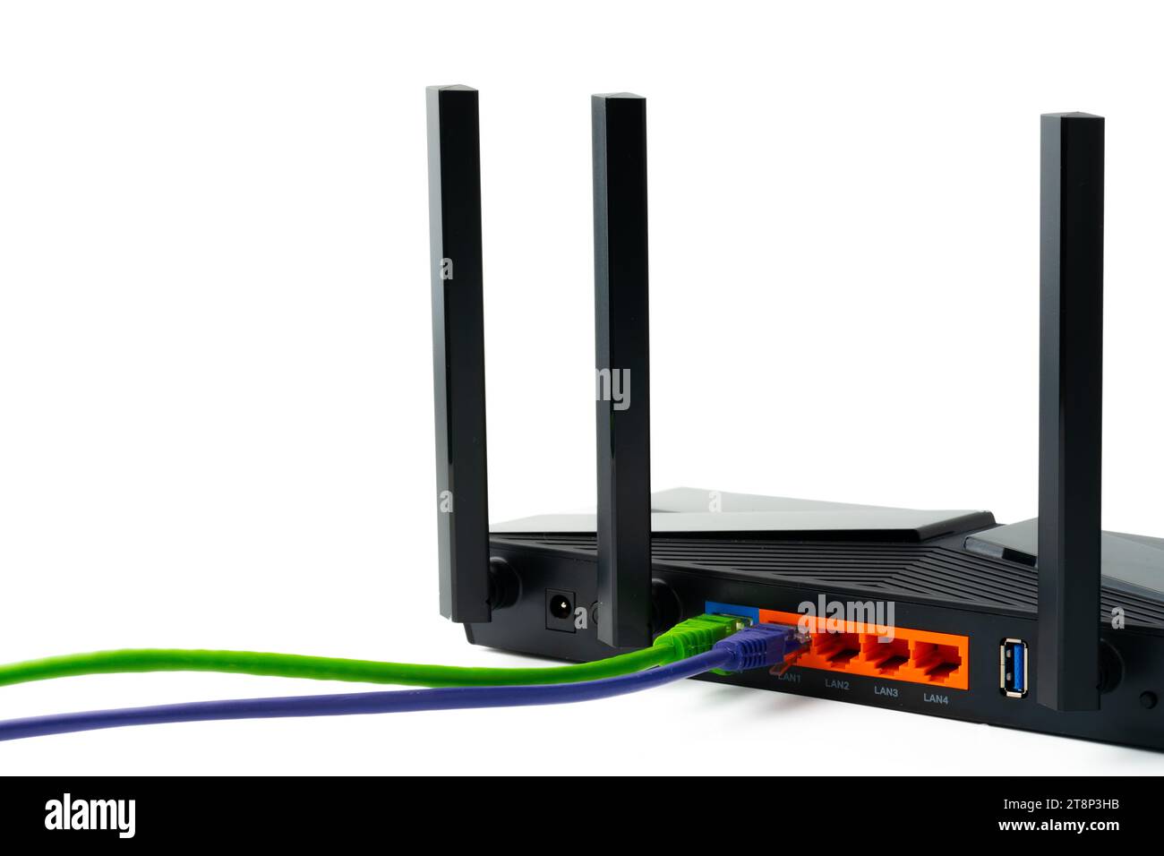 Modern router with cables plugged in close up Stock Photo - Alamy