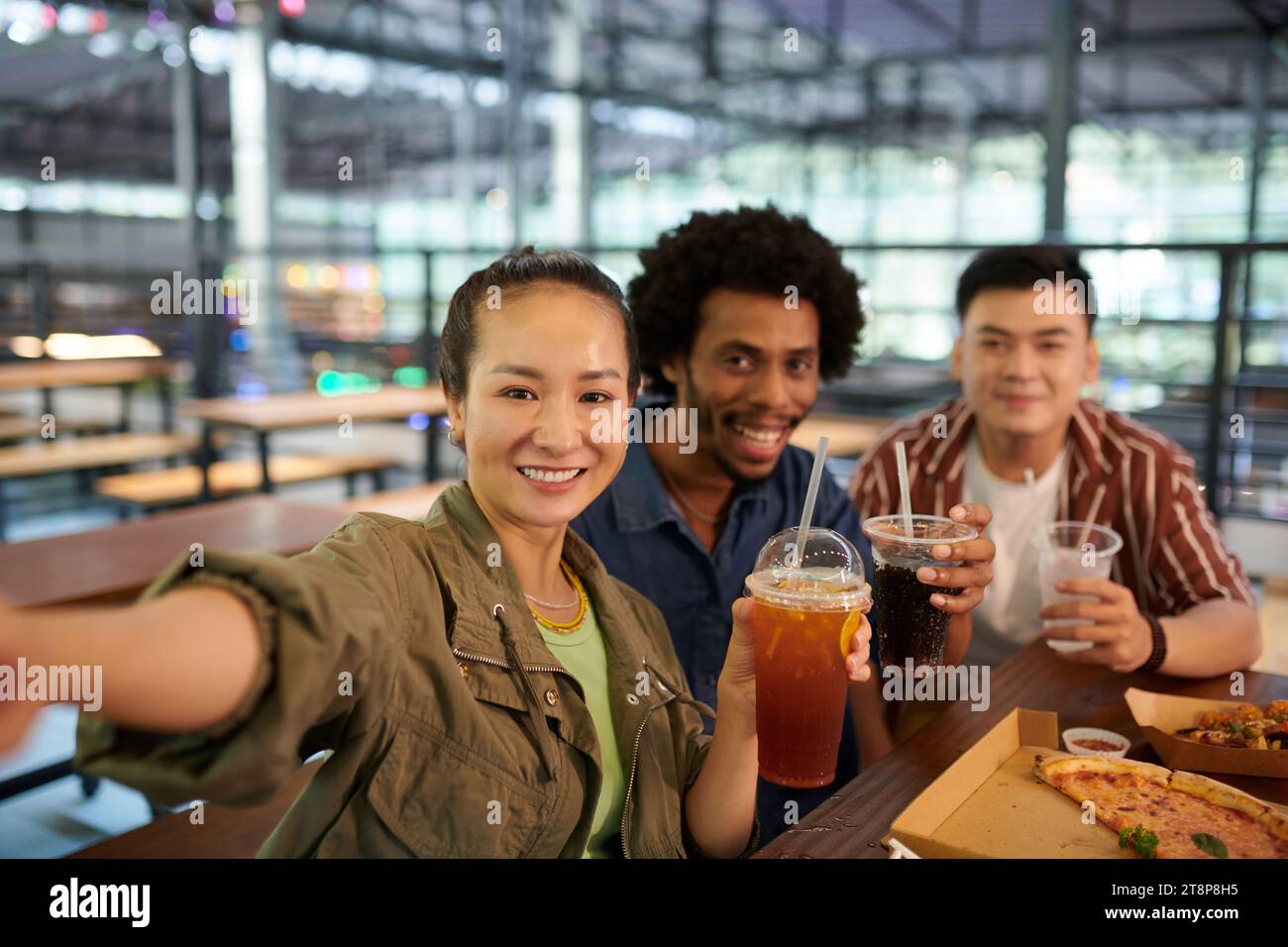 Happy young woman filming vlog for social media when hanging out with ...
