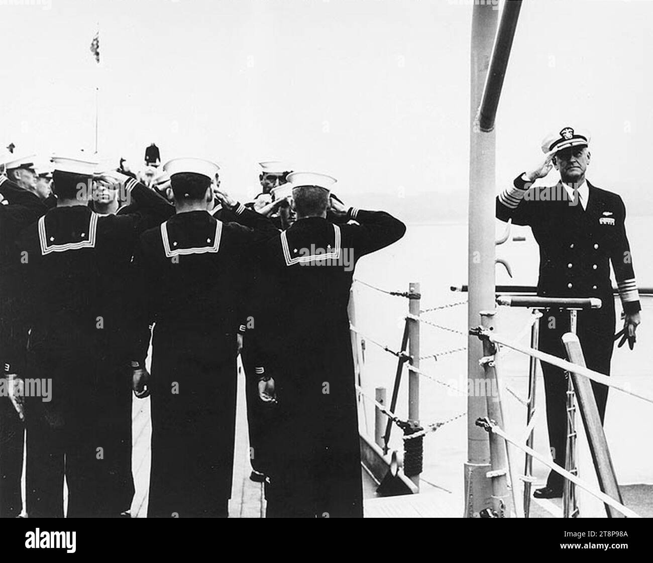 Vice Admiral Lynde D. McCormick (USN) boards USS Columbus (CA-74) on 20 ...