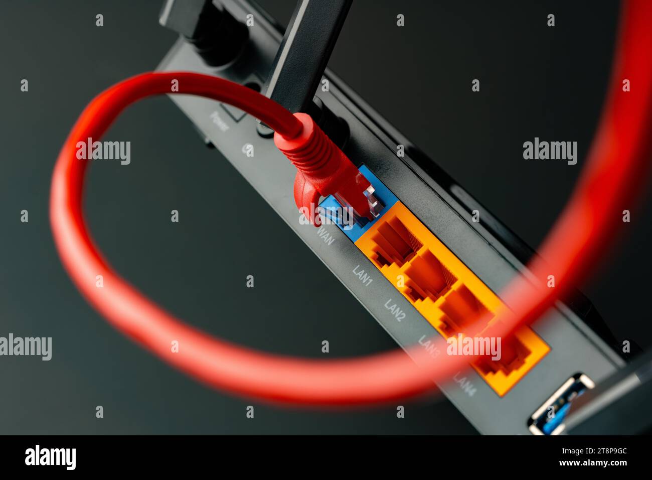 Modern router with cables plugged in close up Stock Photo - Alamy