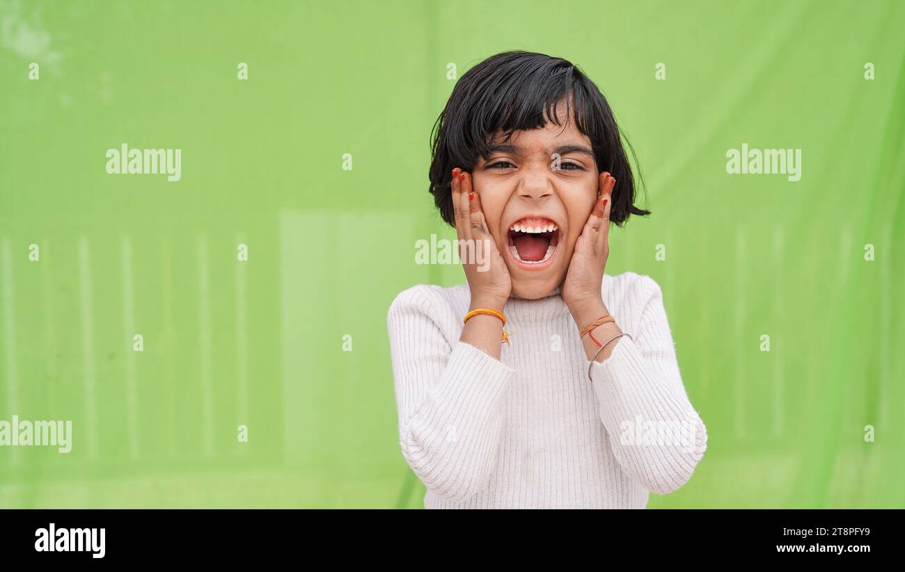 Portrait of surprised cute little toddler girl child standing isolated ...