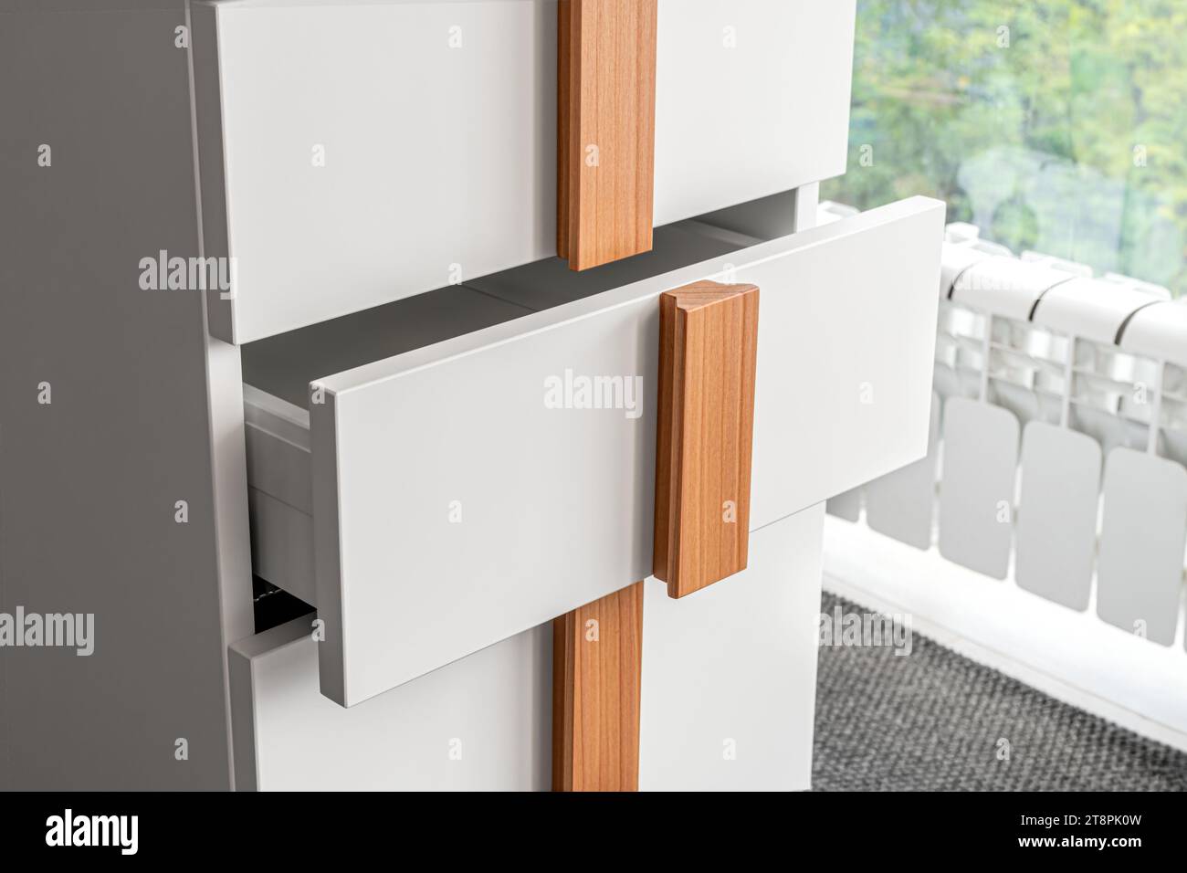 Stylish white office commode with wooden handles and legs with open ...