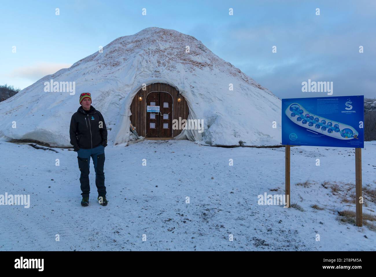 Guide standing outside the Snowhotel Ice Hotel at Kirkenes, Finnmark ...