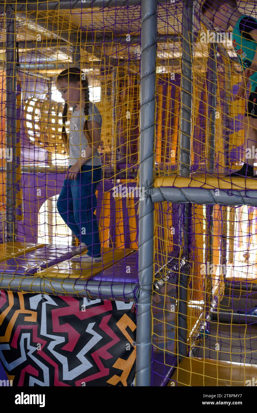 Ivano-Frankivsk, Ukraine June 7, 2023:A little girl runs in a playroom ...