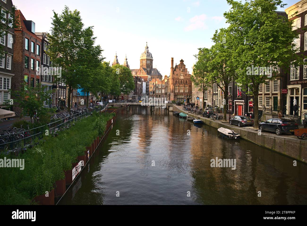 A scenic view of a canal along beautiful buildings in Amsterdam ...