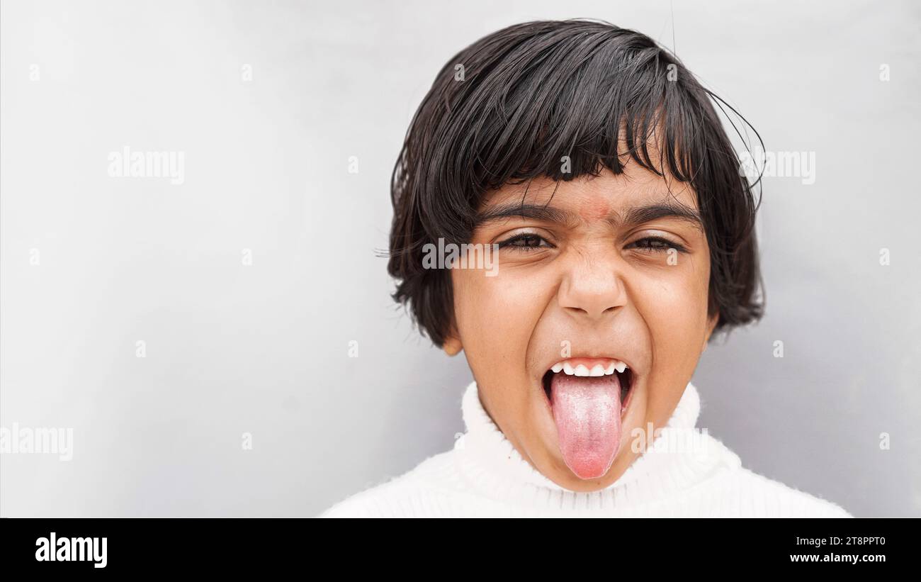 Photo of funky happy cheerful young little girl make funny face good ...