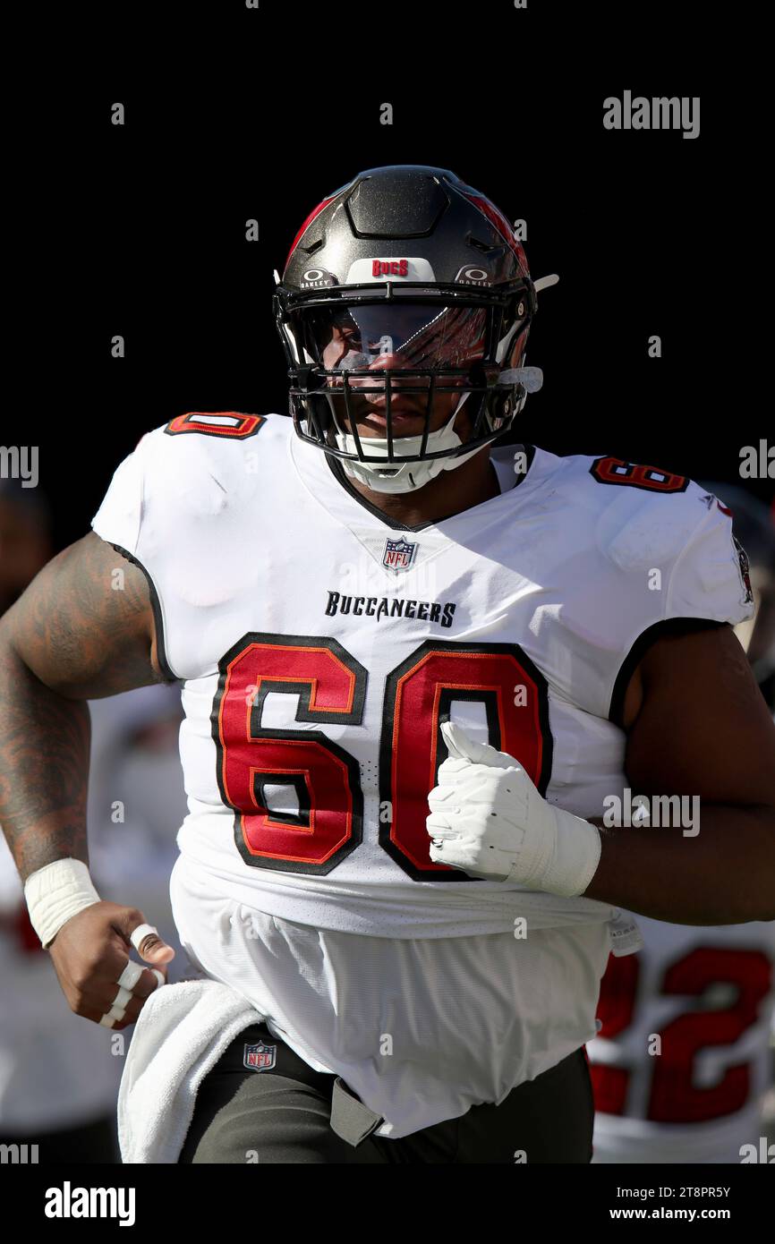 Tampa Bay Buccaneers guard Nick Leverett (60) walks onto the field ...