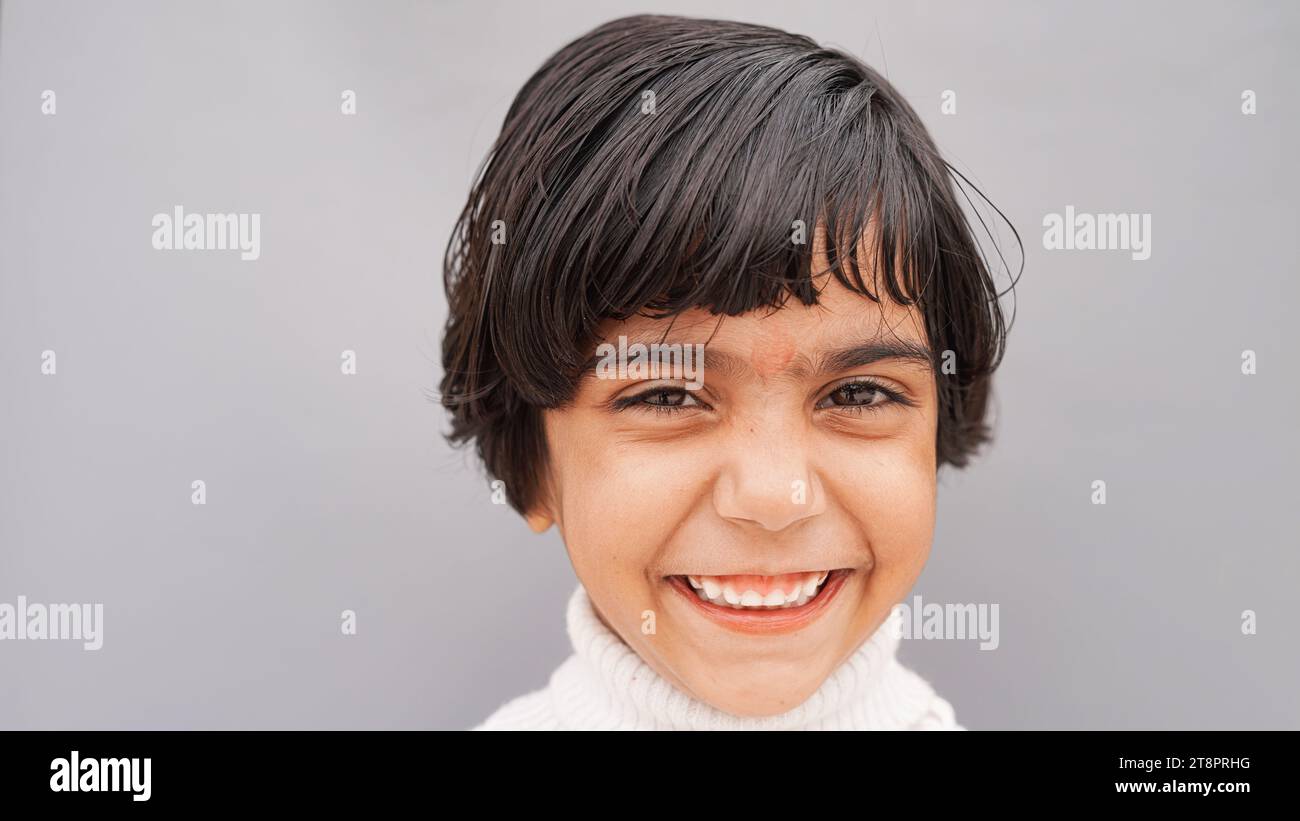 Image of Asian child posing face expression on gray background ...