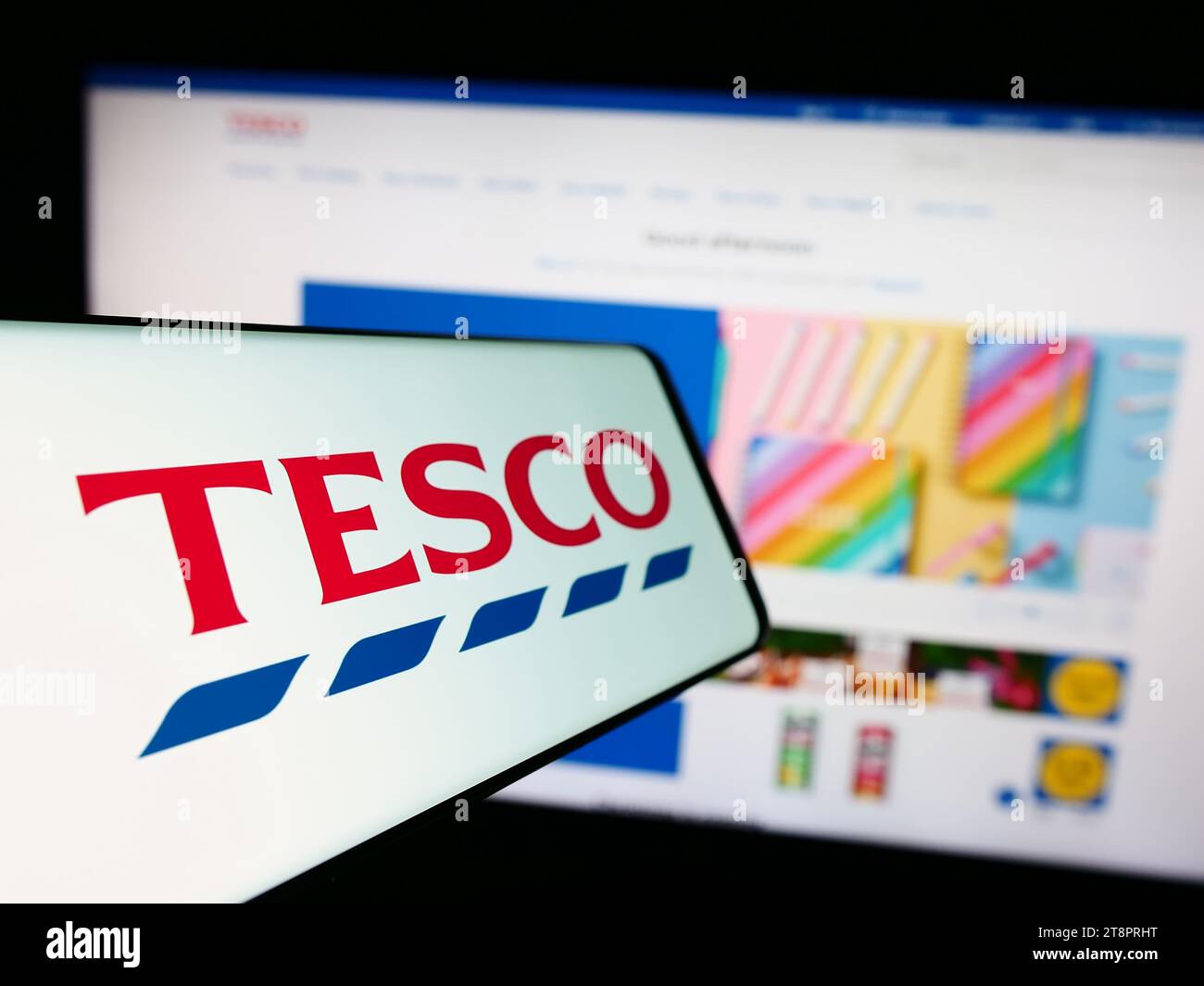 Smartphone with logo of British grocery retail company Tesco plc in ...