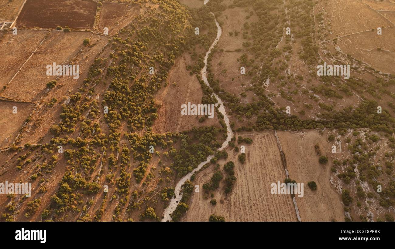 An aerial view of a dried river surrounded by trees Stock Photo - Alamy