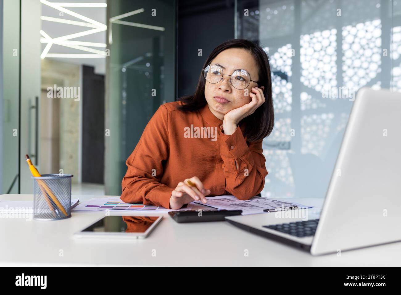 Bored woman at workplace inside office at workplace, boring current ...
