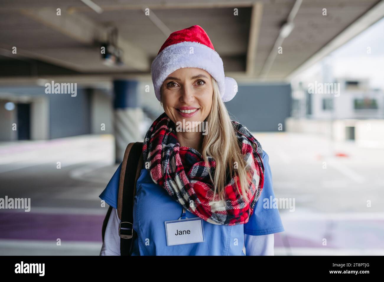 Portrait of beautiful nurse with christmas hat on head. Working in ... Portrait of beautiful nurse with christmas hat on head. Working in ...