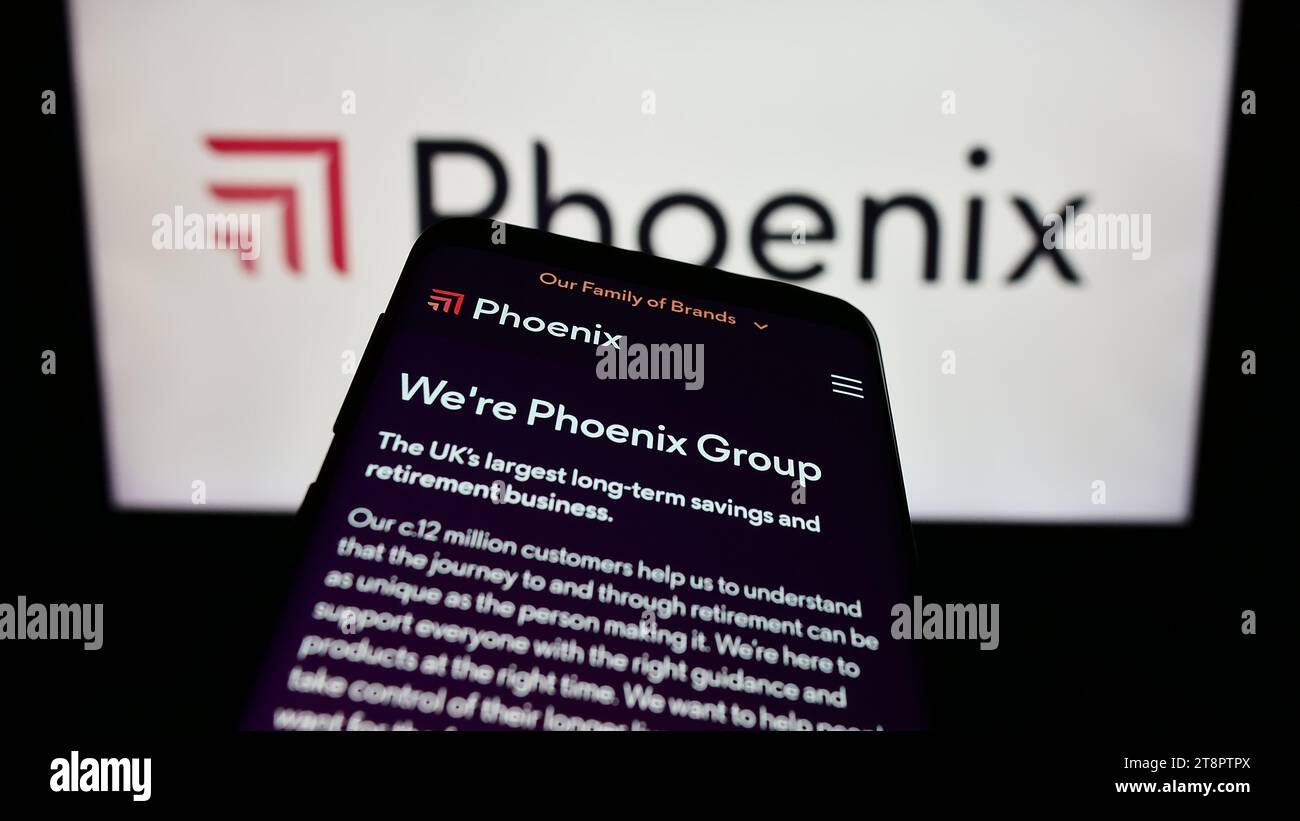 Mobile phone with website of British insurance company Phoenix Group ...