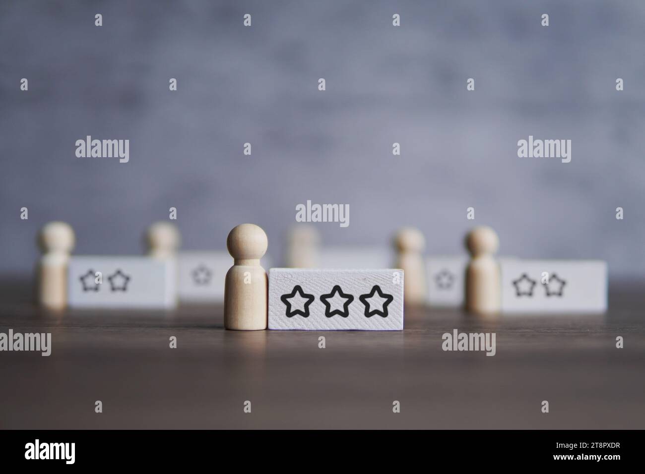 Wooden dolls and star review icon. Employee evaluation, performance and ...