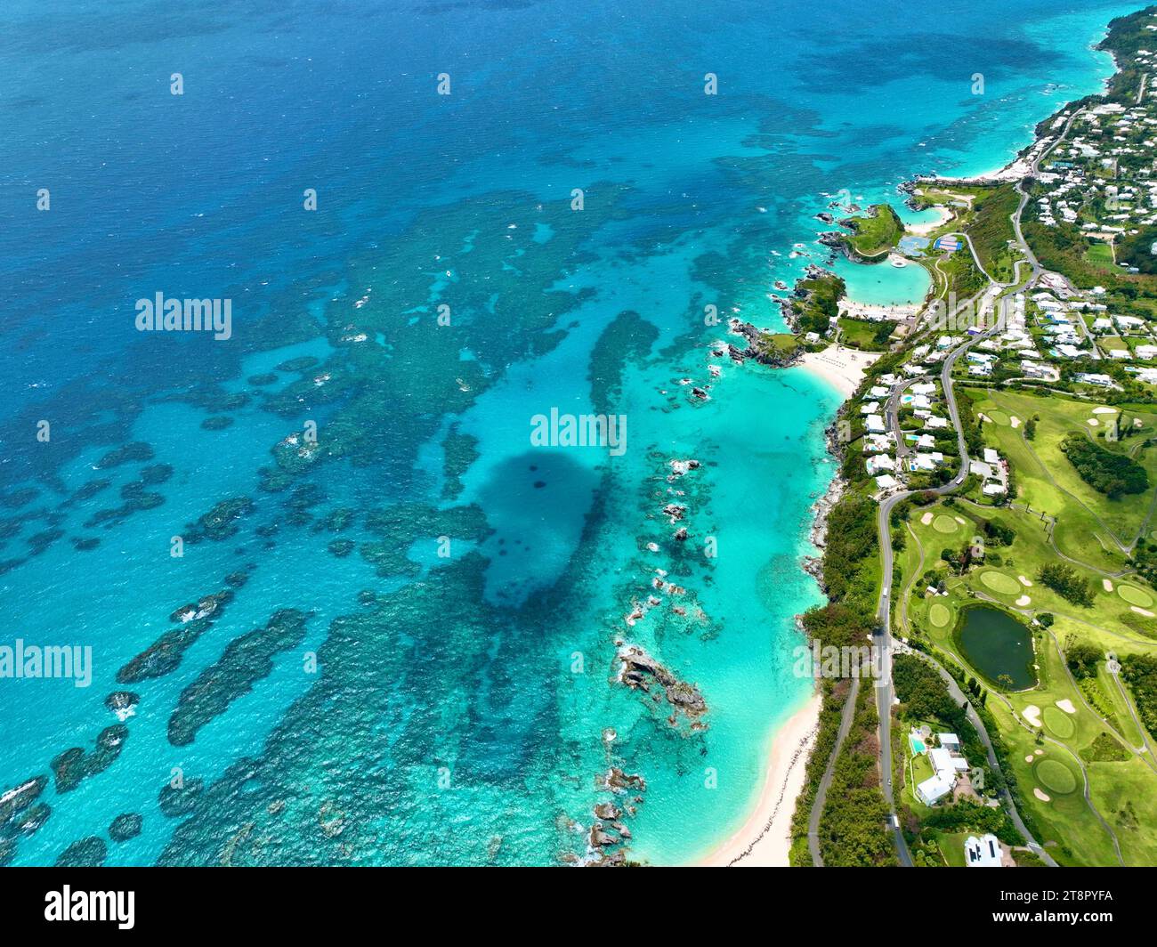 Aerial view of a vibrant cityscape with crystal blue green waters in ...