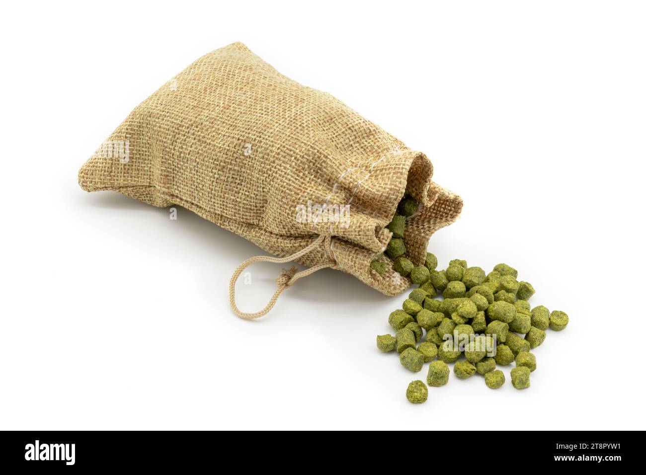 Small jute bag with pile of green hops pellets on white background ...