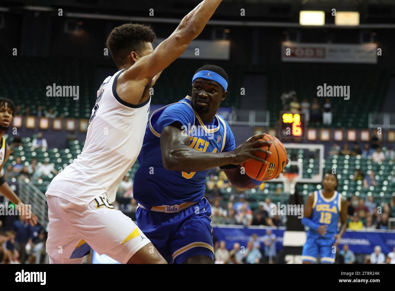 Ucla Forward Adem Bona 3 Shoots Over Marquette Forward Oso Ighodaro