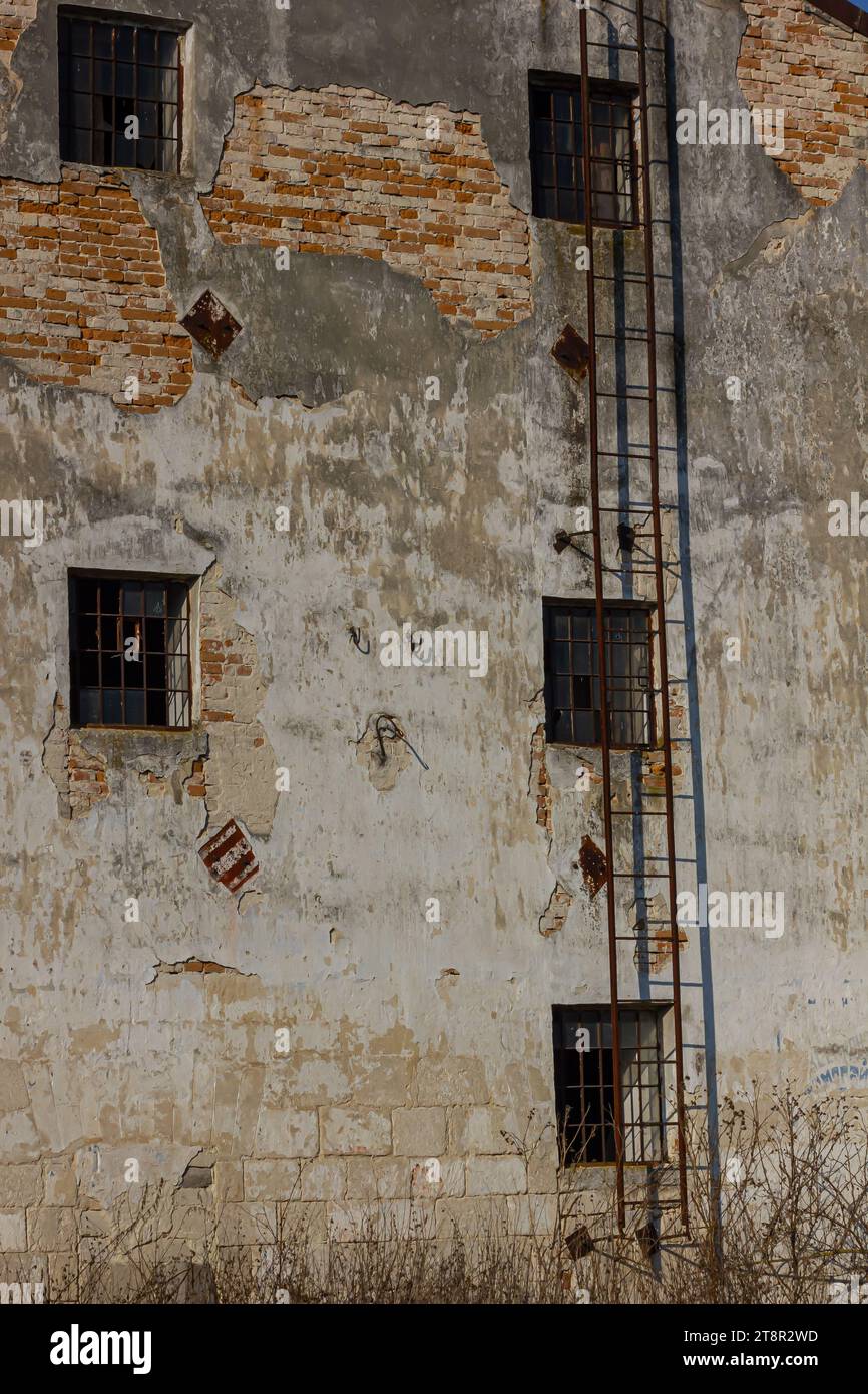 Exterior of old brick building with rusted fire escape Stock Photo - Alamy