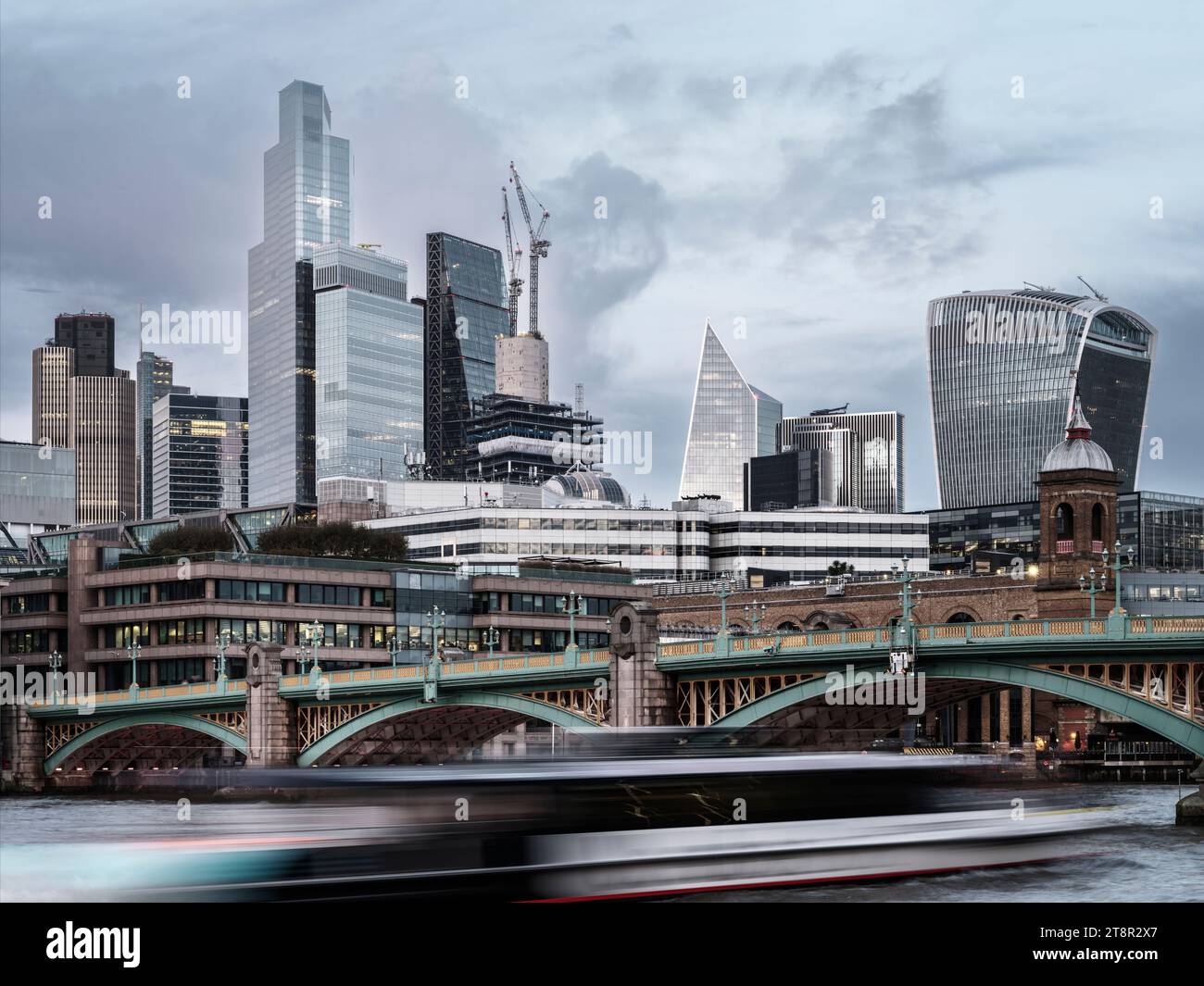 Southwark - London, England. A Water Taxi passes under Southwark Bridge ...