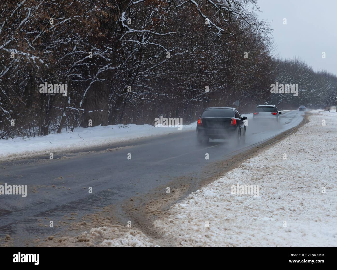 driving in winter after a snowfall, ice on the road, temperatures below ...