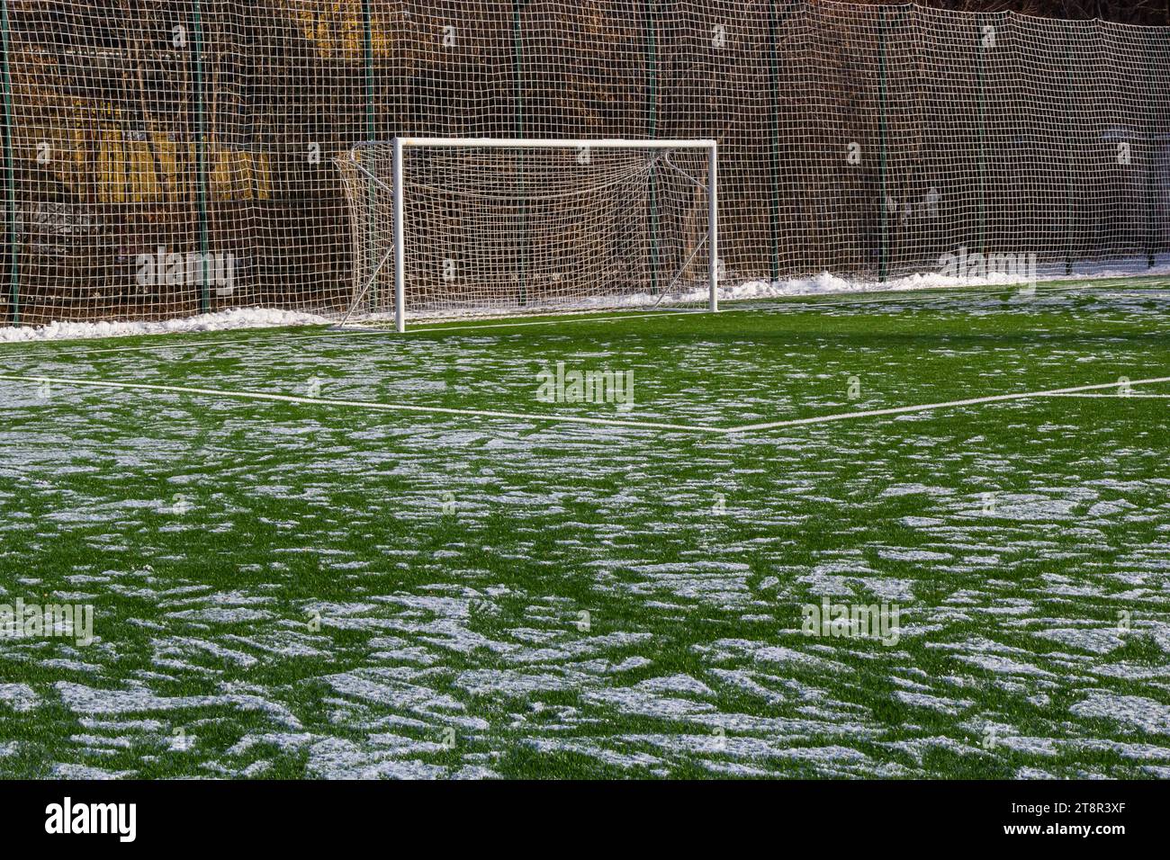 field for playing football in winter, artificial grass on cleared of ...