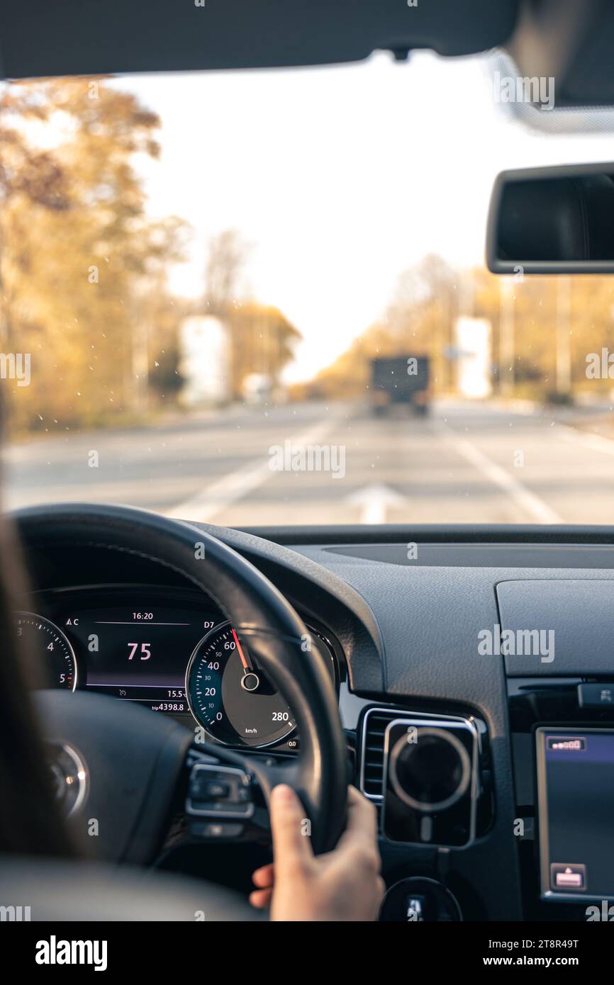 Woman driver hands on steering wheel inside car Stock Photo - Alamy