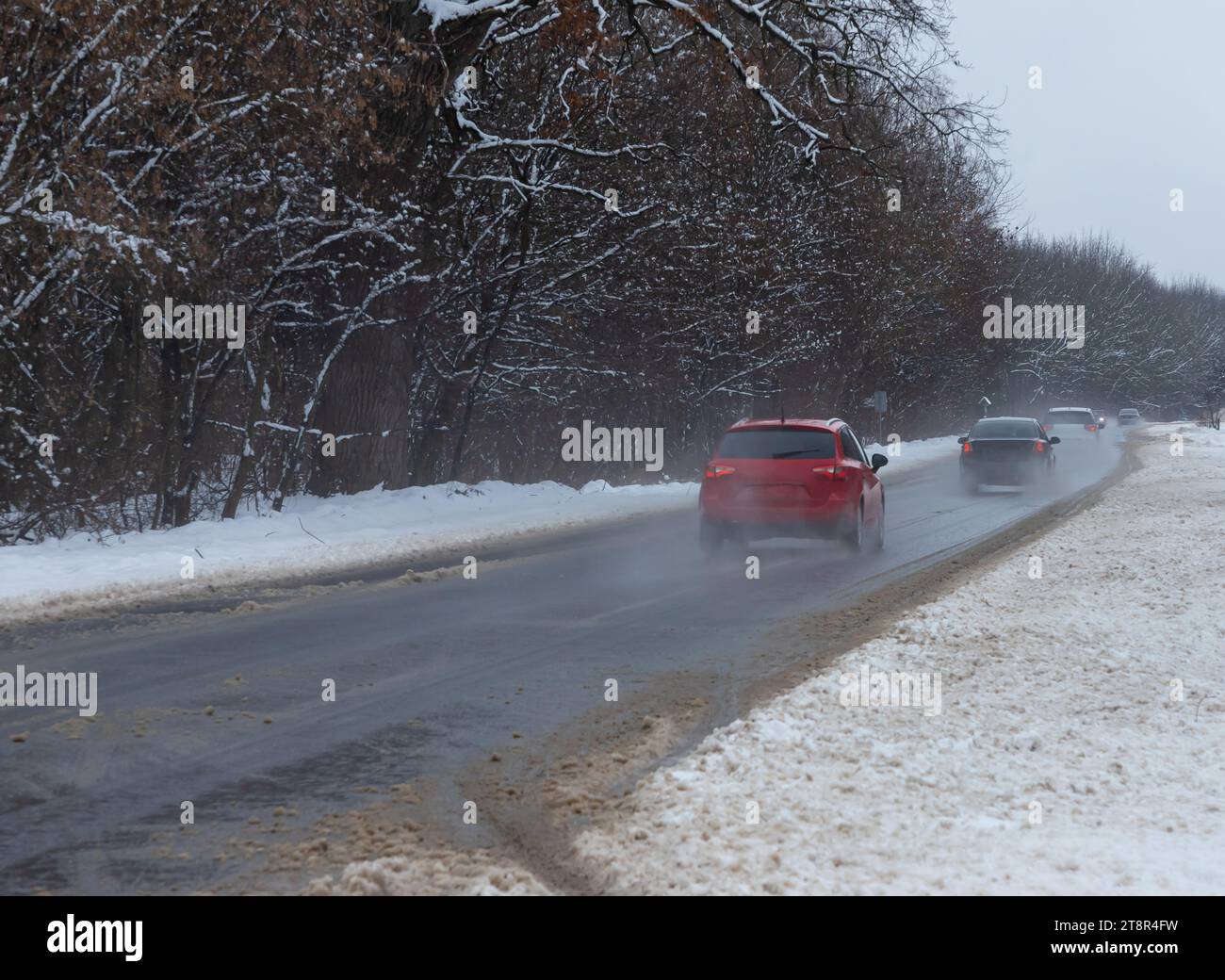 driving in winter after a snowfall, ice on the road, temperatures below ...