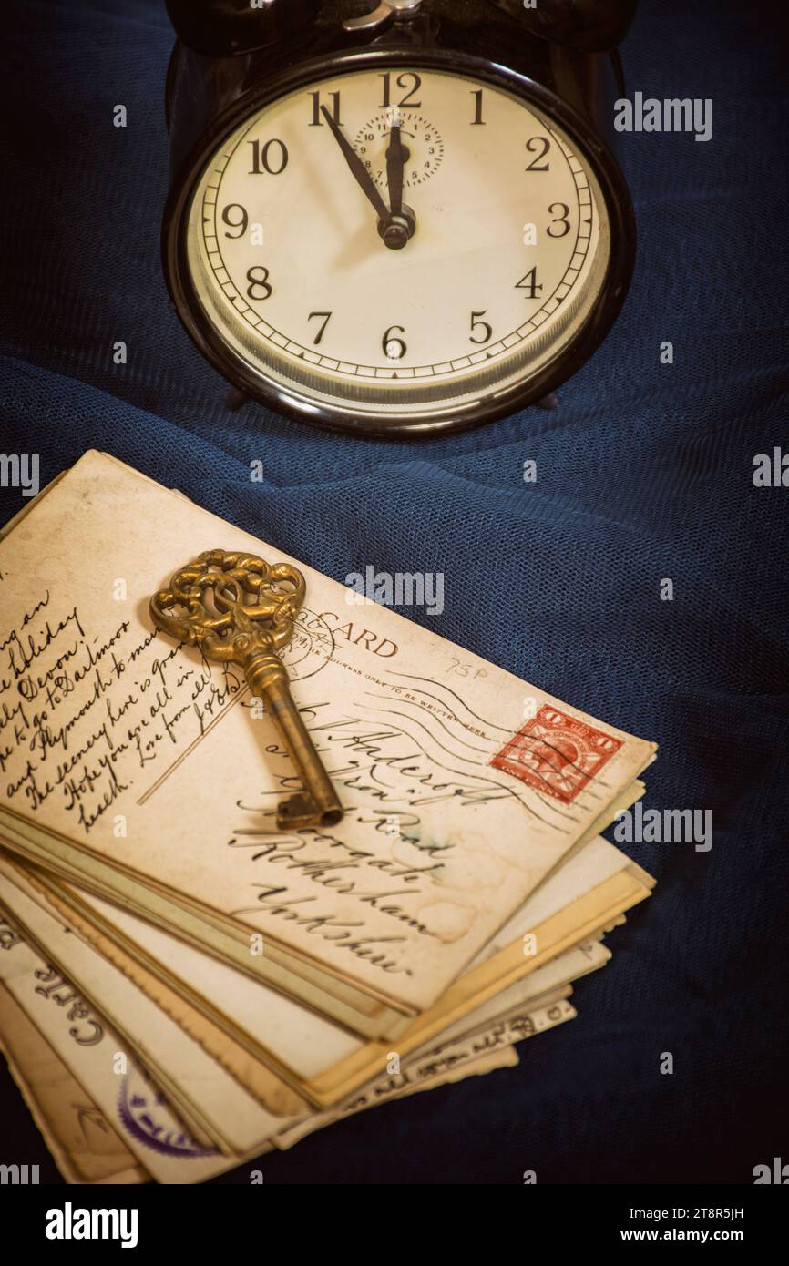 Old key over postcards Stock Photo - Alamy
