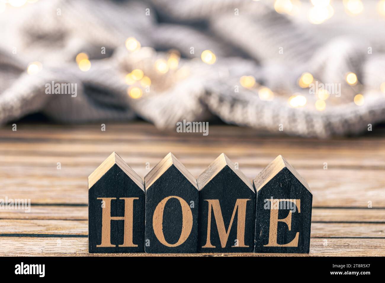 Cozy background with decorative word Home on a blurred background with ...
