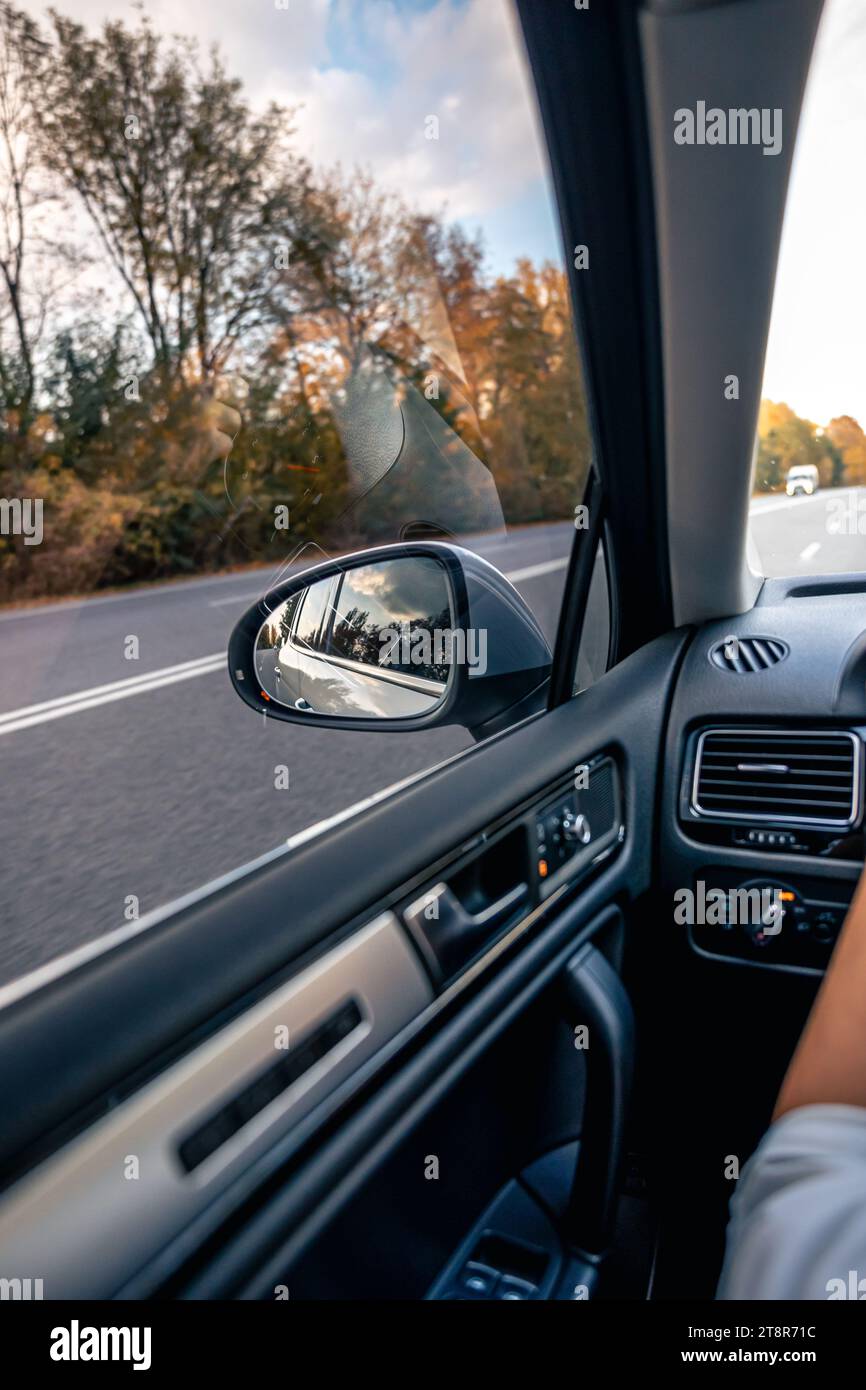 Car rear view mirror, view from inside the car Stock Photo - Alamy