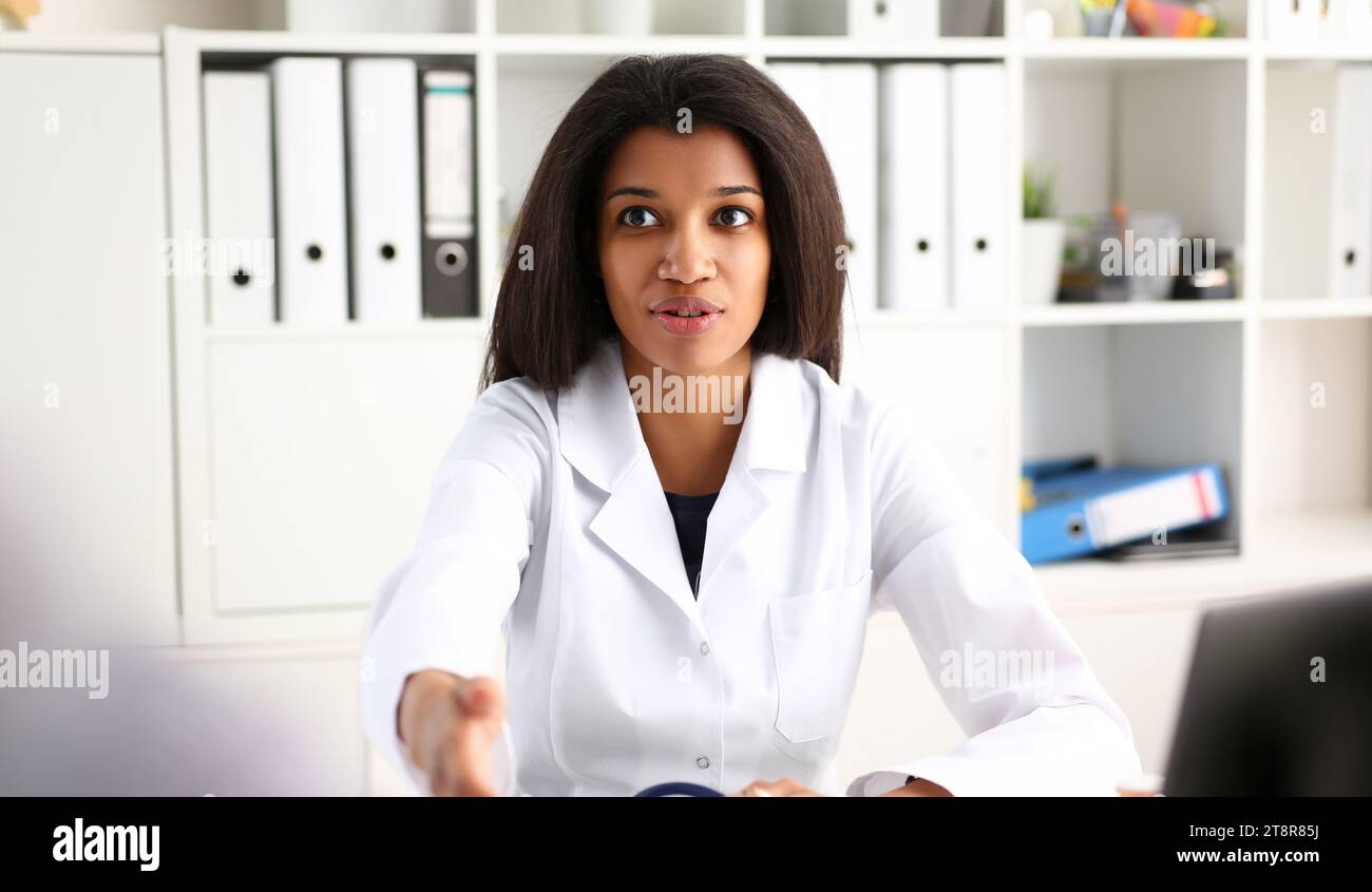 Doctor shake hand as hello with patient Stock Photo - Alamy