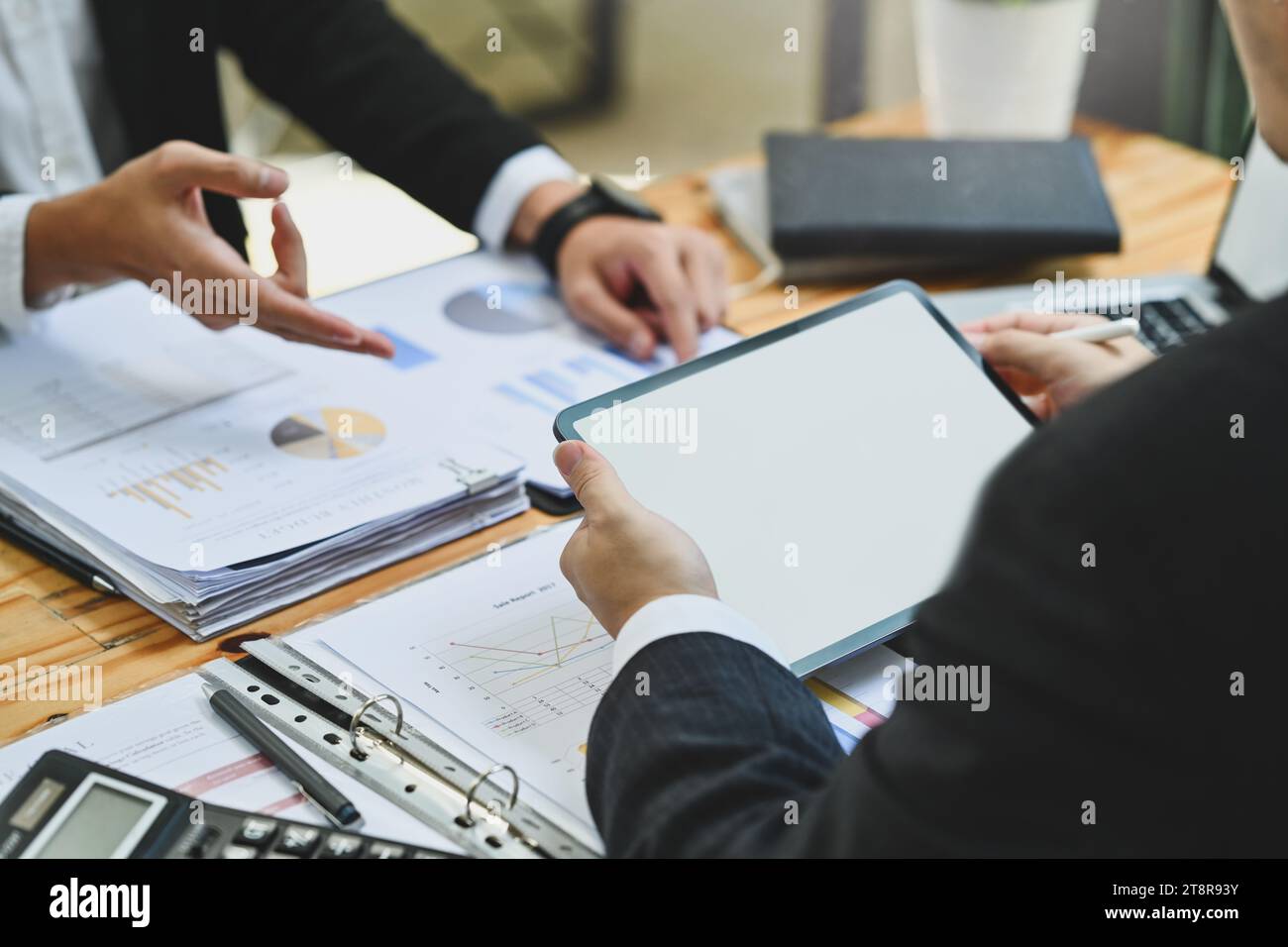 Successful business people discussing over new business project and ...