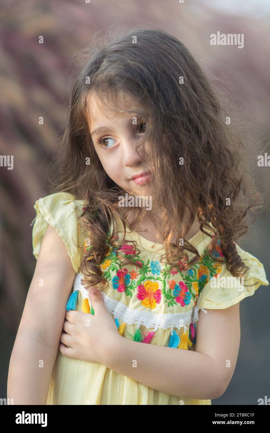 Beautiful 3 years old girl looking away outdoors Stock Photo - Alamy