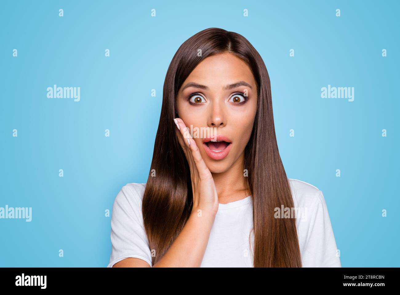 Portrait of brown-haired gorgeous nice amazed young lady showing shock ...