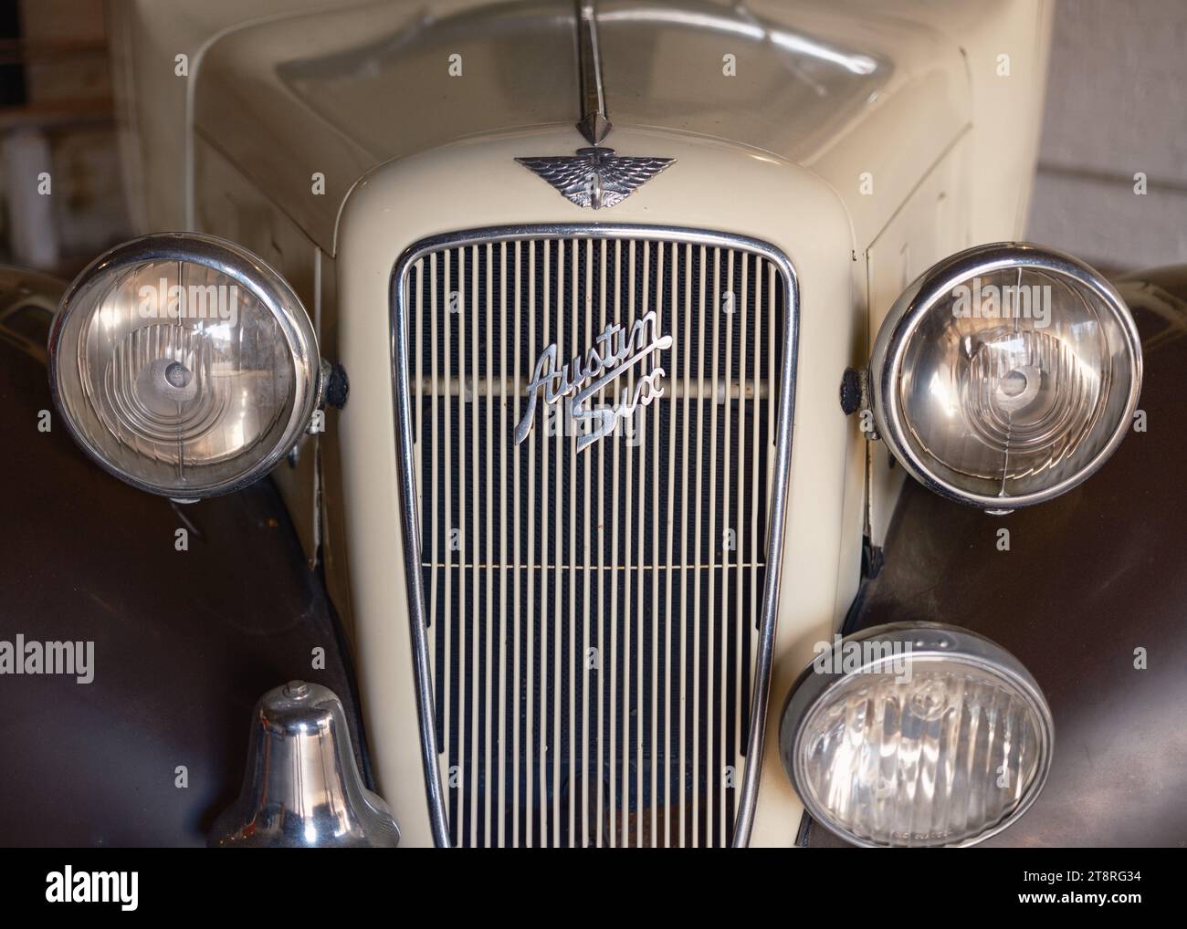 The front of a cream coloured vintage Austin Six automobile on display ...