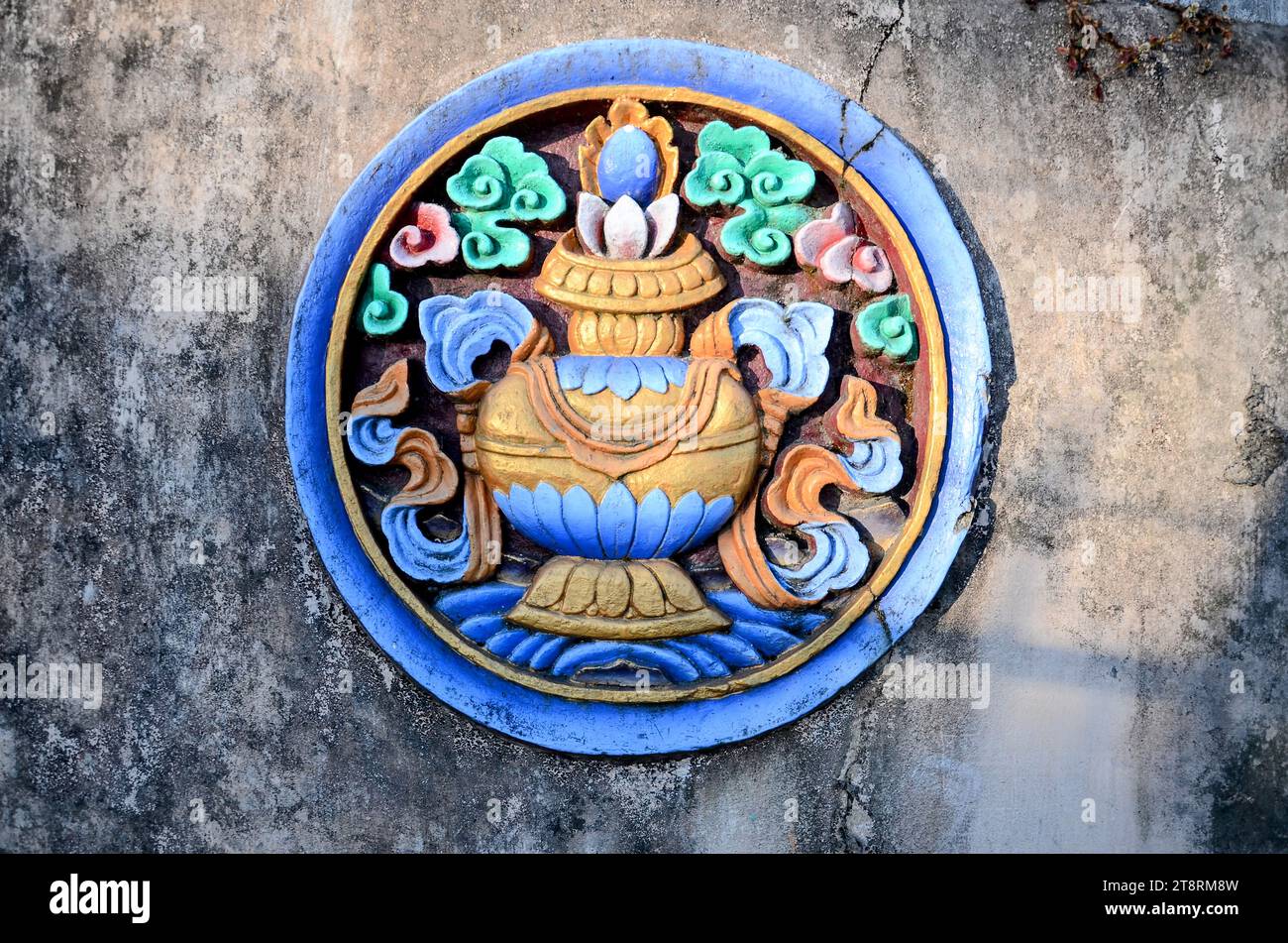 A colorful, hand-crafted tile displayed on a wall, adding a unique ...