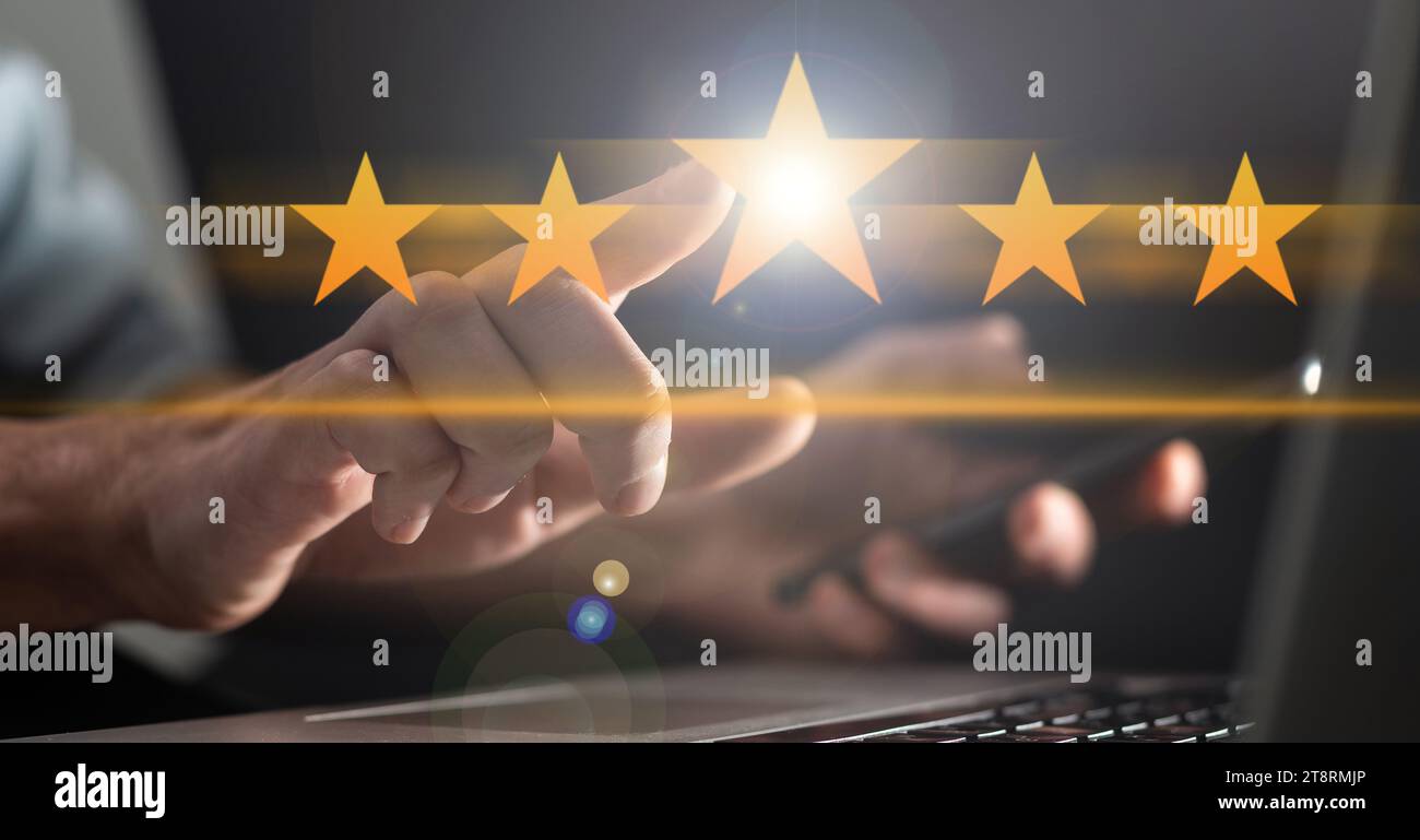 Please rate us banner wtih customer hand give five golden stars Stock ...
