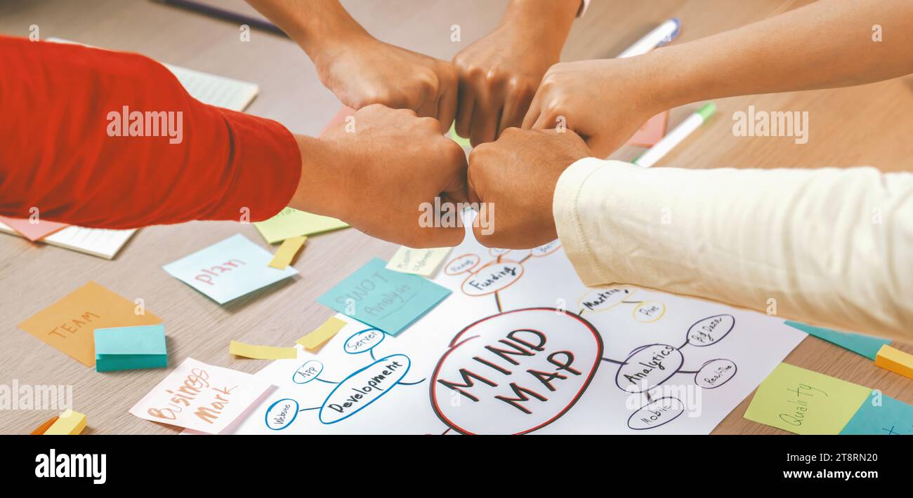 Young happy creative startup group join circle fist bump hands together ...