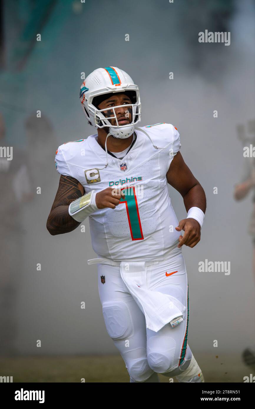Miami Dolphins quarterback Tua Tagovailoa (1) runs onto the field ...
