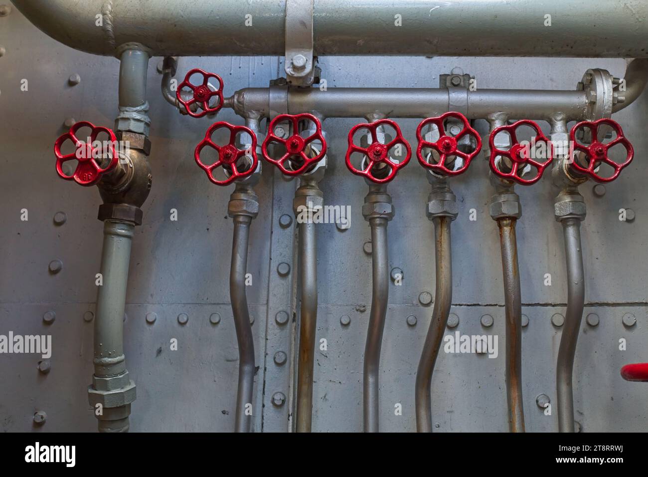 Pipe lines and manual operated valves to control system Stock Photo - Alamy