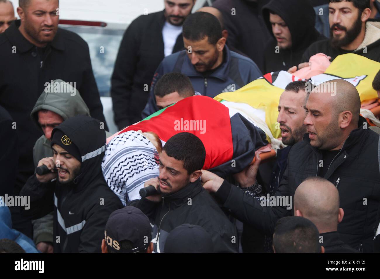 EDITORS NOTE: GRAPHIC CONTENT. Mourners carry the body of 21-year-old ...