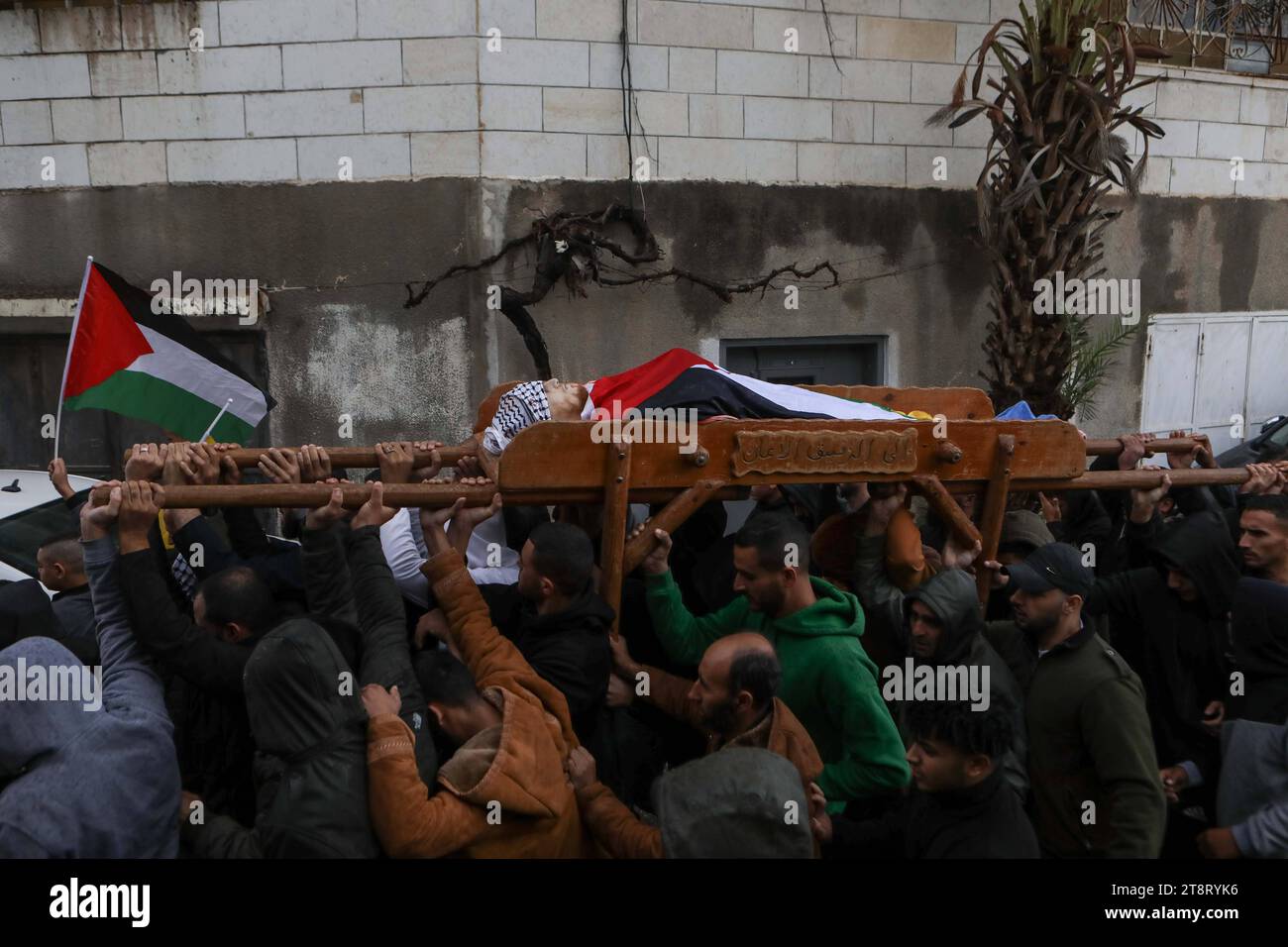 EDITORS NOTE: GRAPHIC CONTENT. Mourners carry the body of 21-year-old ...