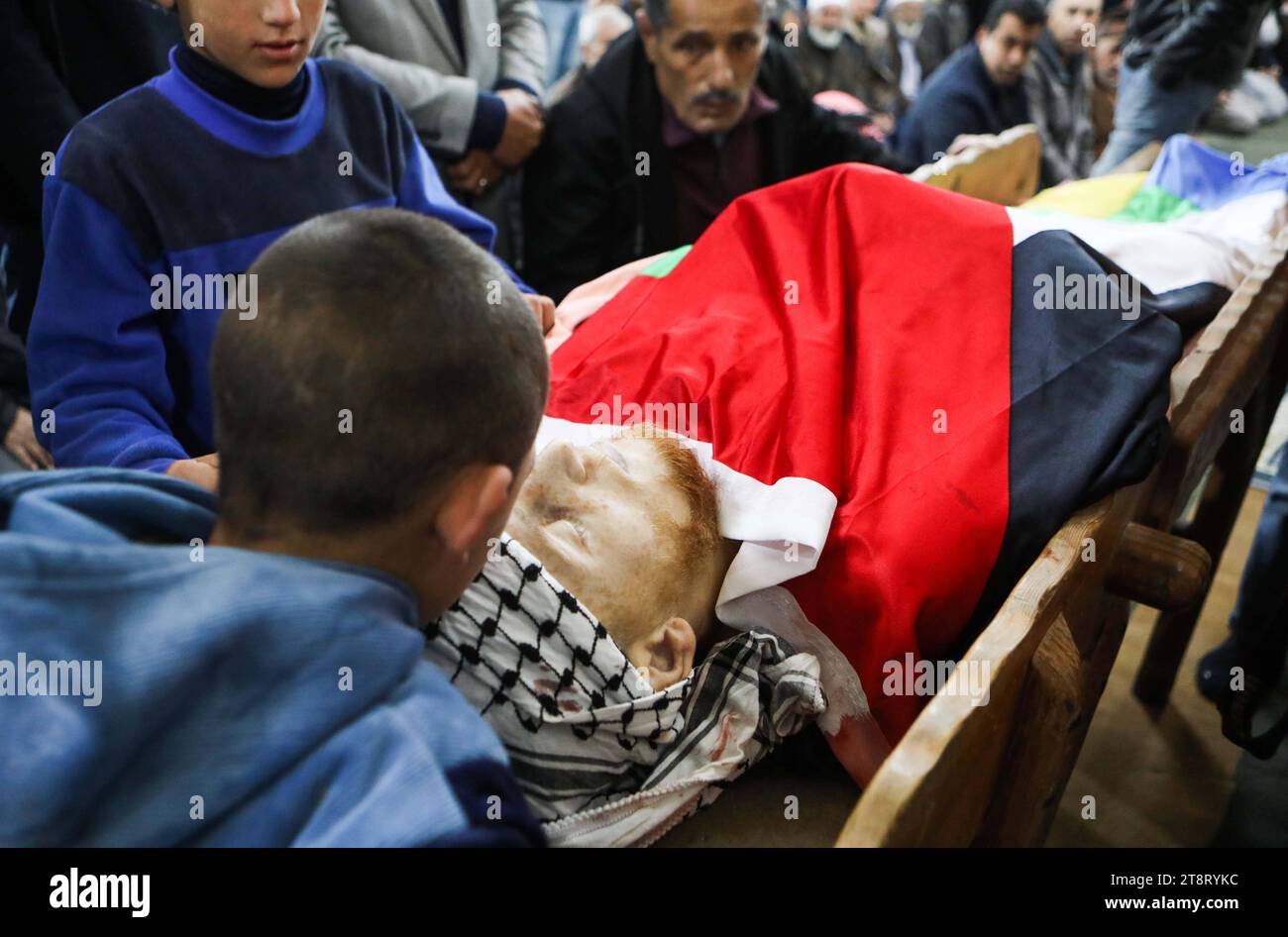 EDITORS NOTE: GRAPHIC CONTENT. Mourners carry the body of 21-year-old ...