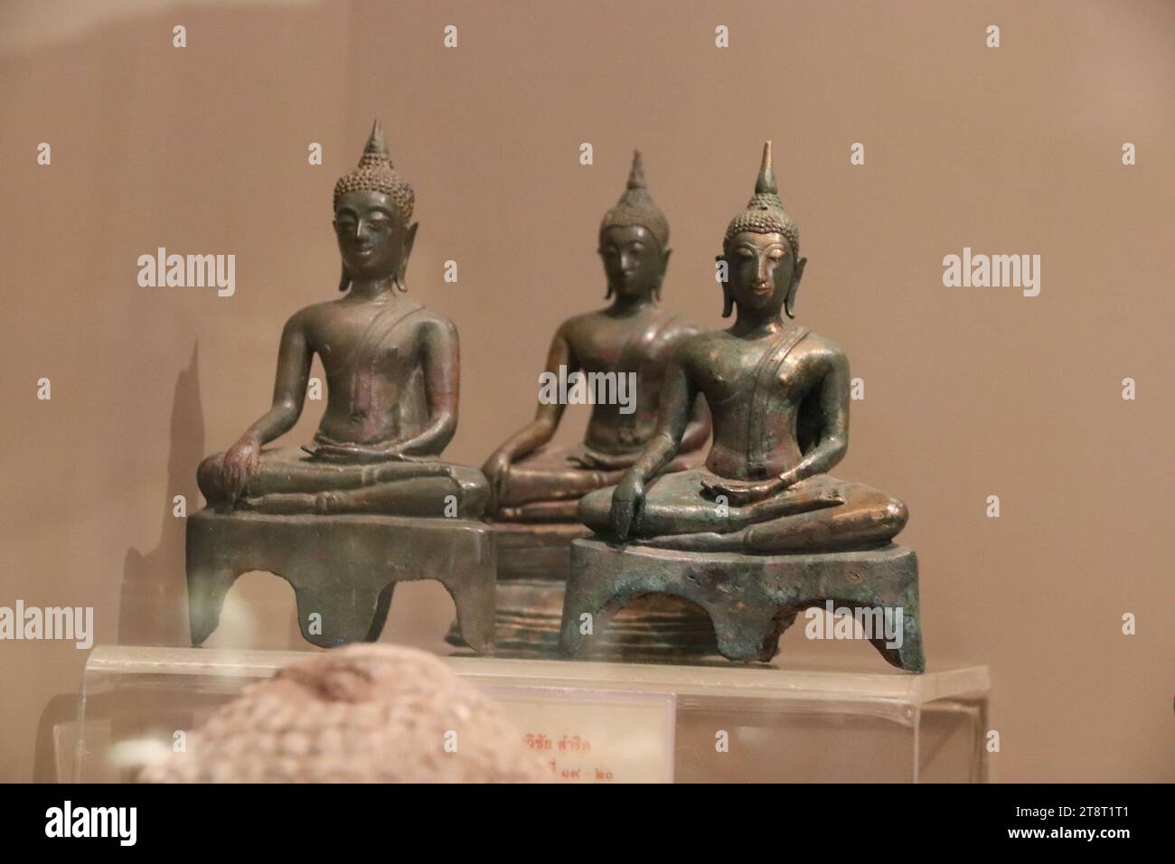 Bronze buddhas subduing mara hi-res stock photography and images - Alamy