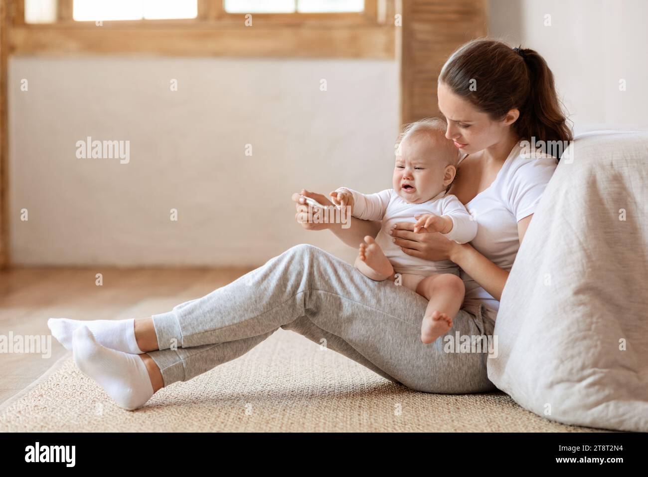 Mother testing temperature of infant kid, child, check for fever Stock ...