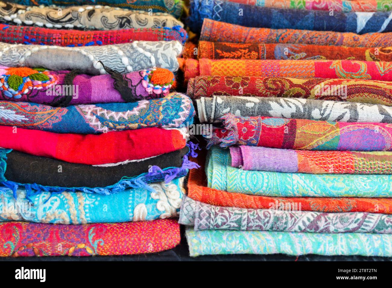 Folded fabrics textiles with patterns on the market Stock Photo - Alamy