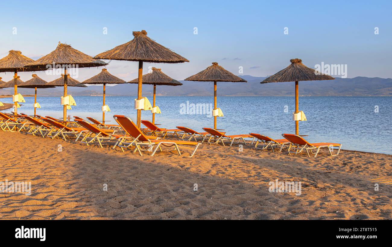 Thatched parasols on a beach on Lesbos island in Greece. Idyllic scene ...