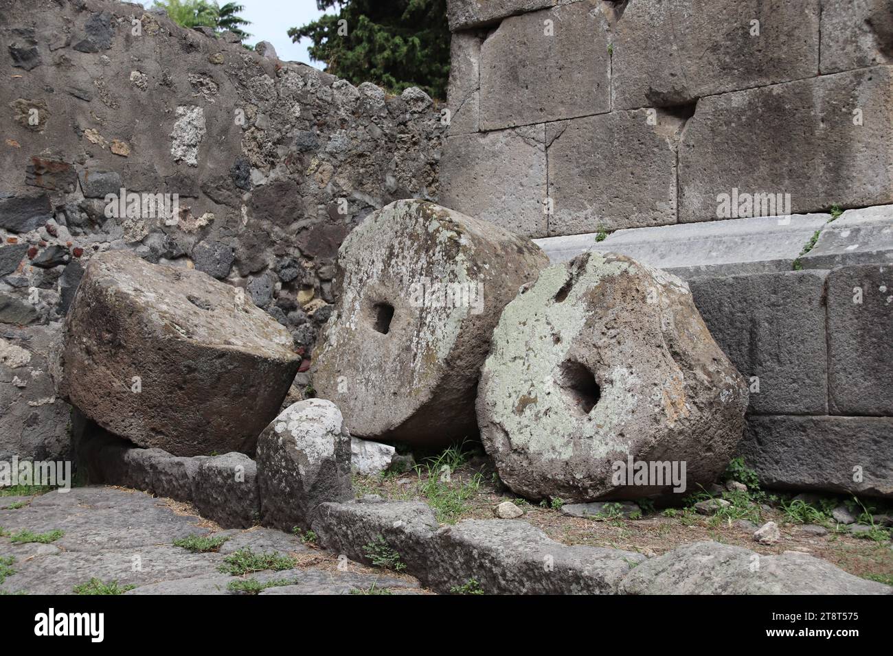 Pompeii Ruins: Millstones, Remains of Roman city buried by eruption of ...
